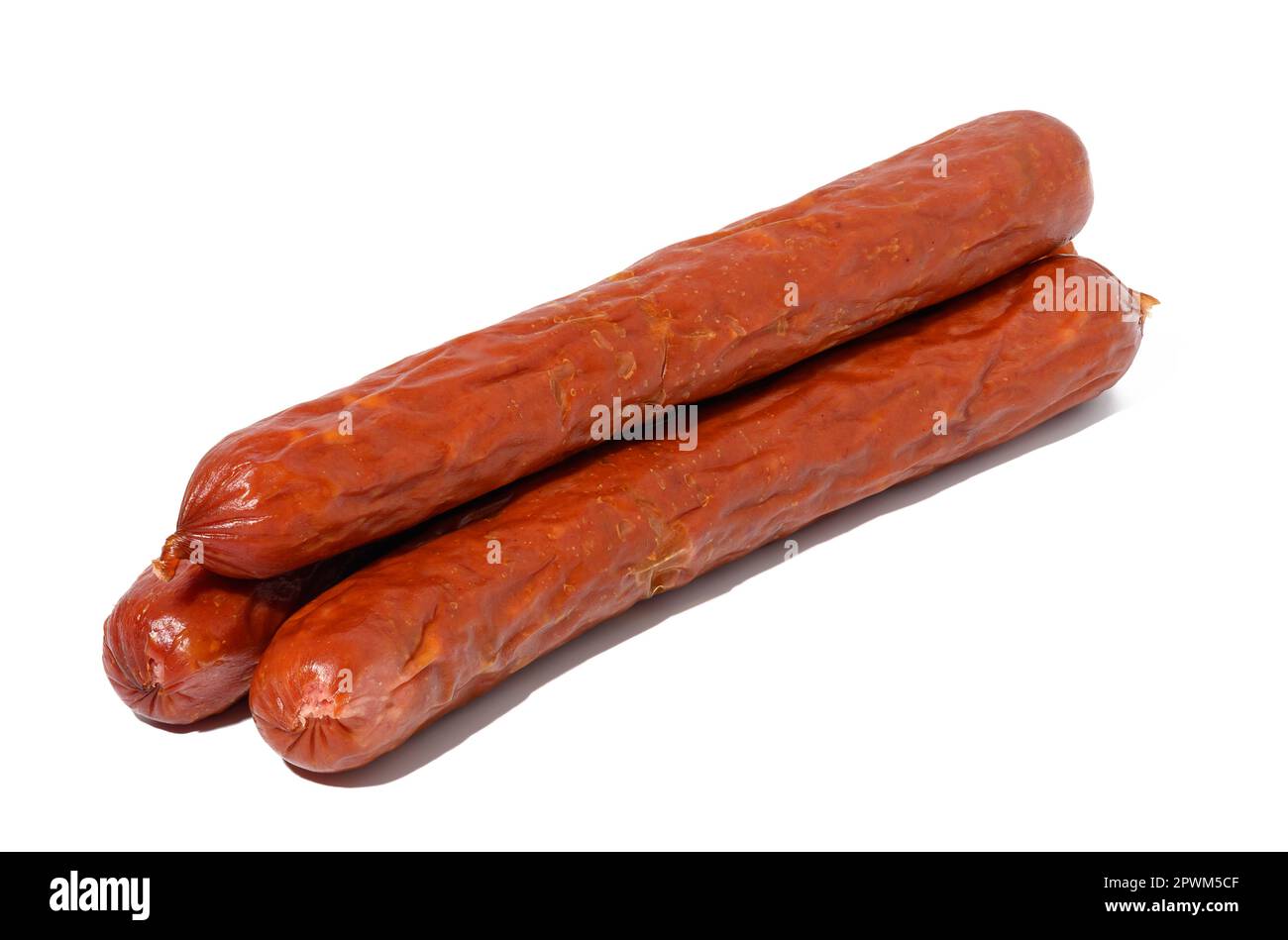 Small smoked sausages on a white isolated background Stock Photo - Alamy