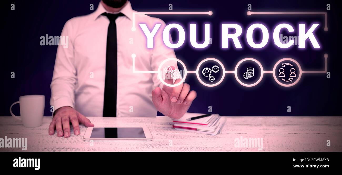 Hand writing sign You Rock, Word Written on slang phrase of praise or ...