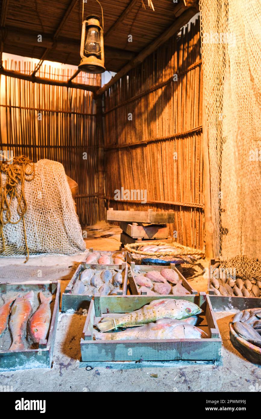A seaside, thatch stall displaying fresh caught fish, seafood for sale ...