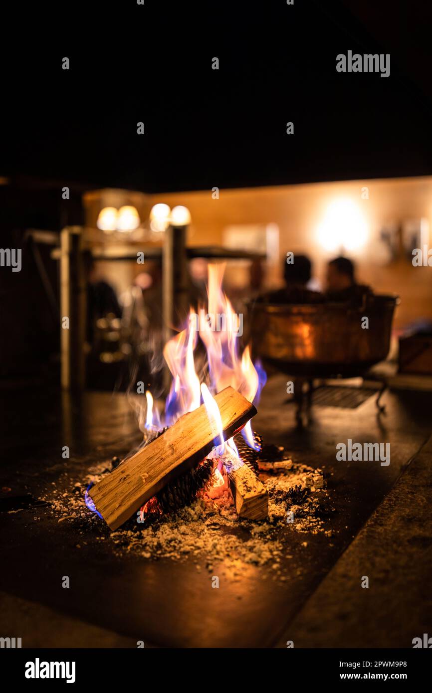 Open fireplace in a cosy restaurant Stock Photo - Alamy