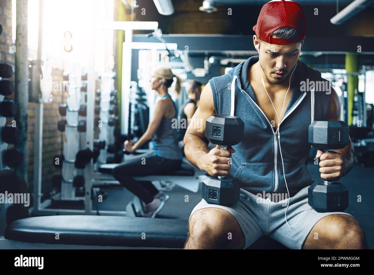 Life is too short to be small. a man doing a upper-body workout at the ...