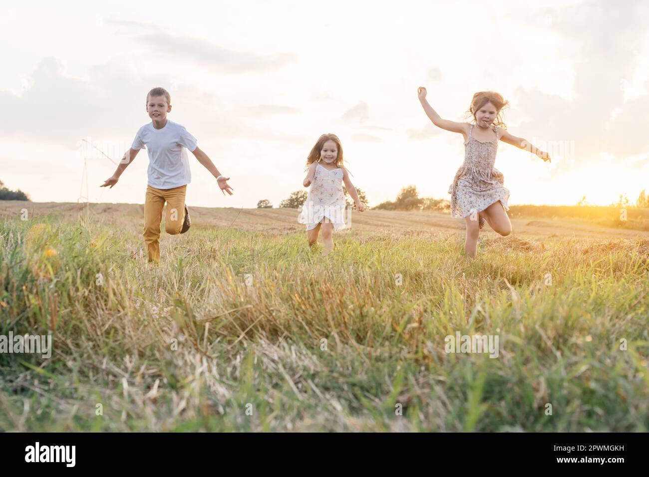 Child jumping on hay in hi-res stock photography and images - Alamy