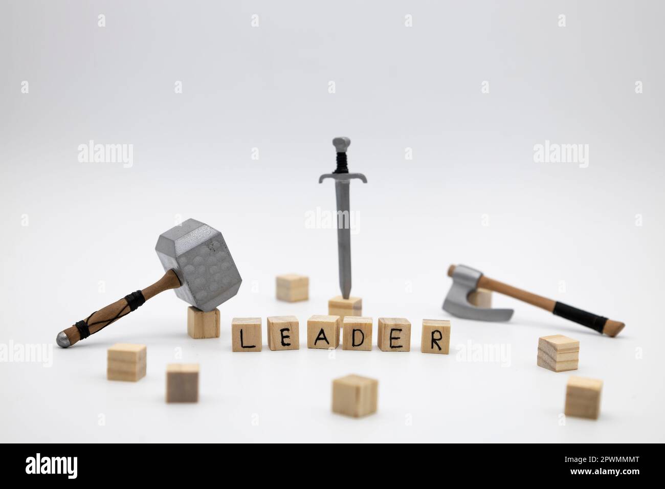 The wooden cubes with the word LEADER and the weapon around against ...