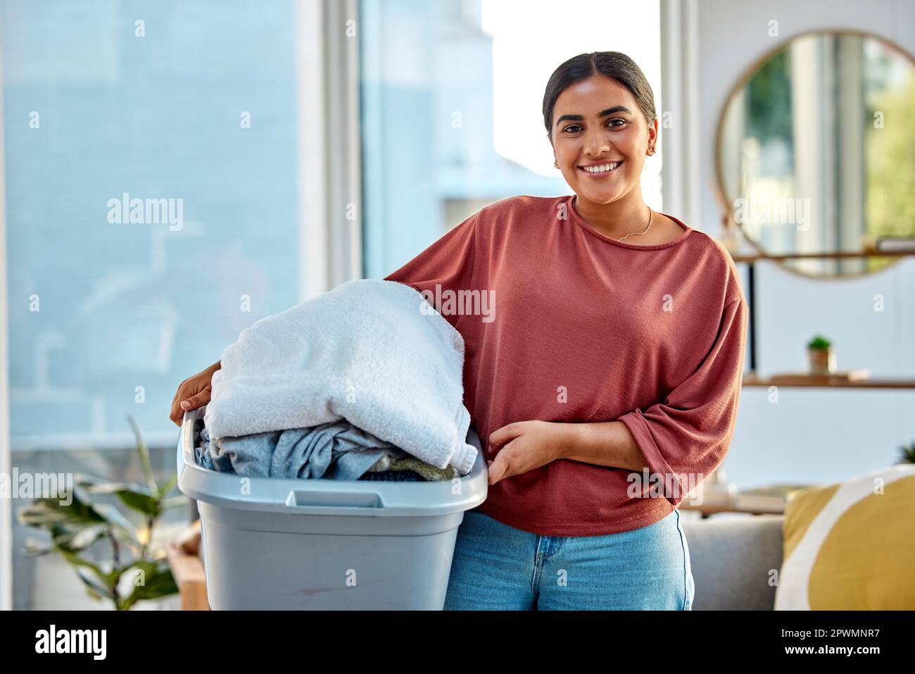 Woman, laundry and portrait smile for clean clothes, personal hygiene ...