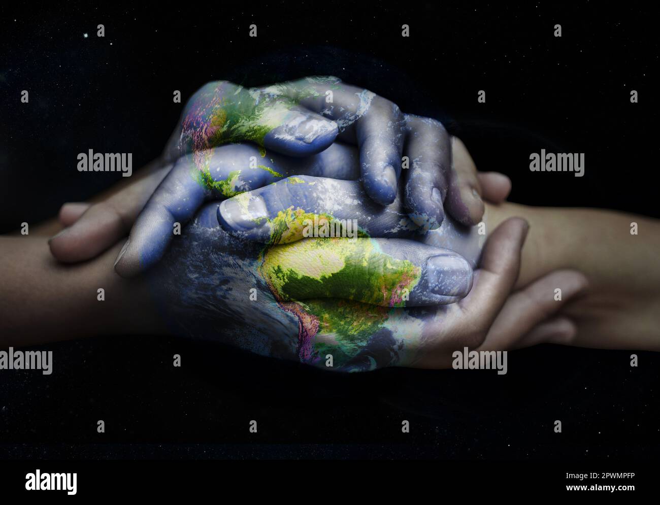 Multiracial hands holding globe hi-res stock photography and images - Alamy