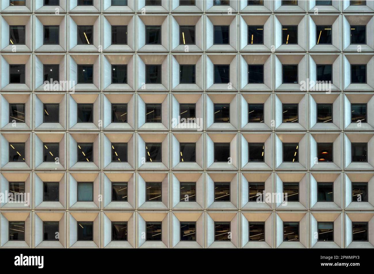 Facade of urban skyscraper rows of square geometric pattern windows ...