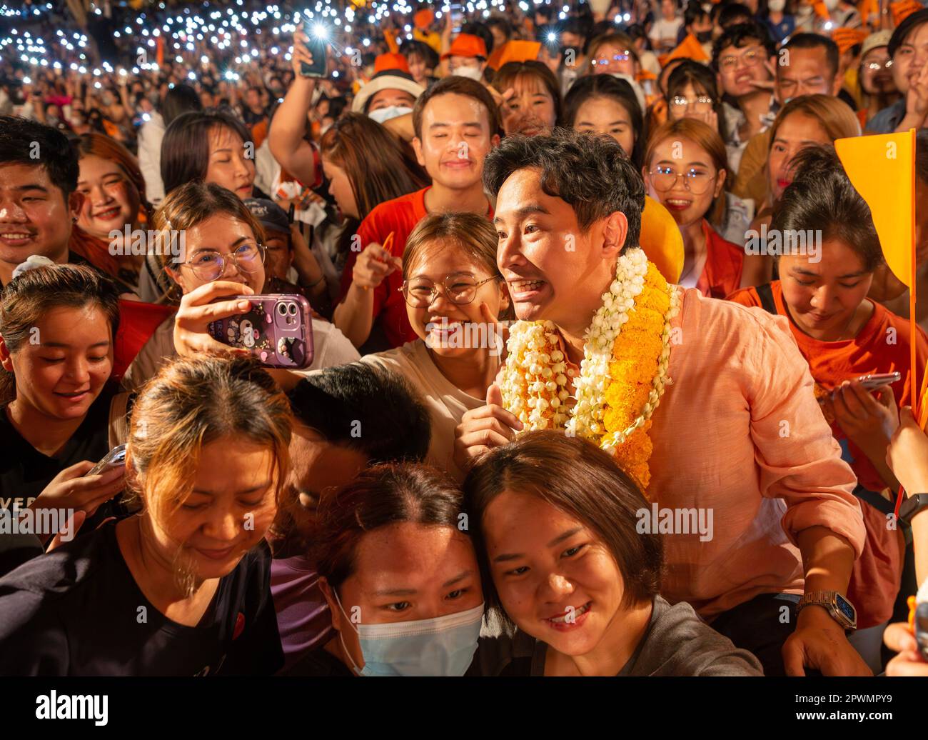 Leader of Move Forward Party Pita Limjaroenrat (C) poses for photos ...