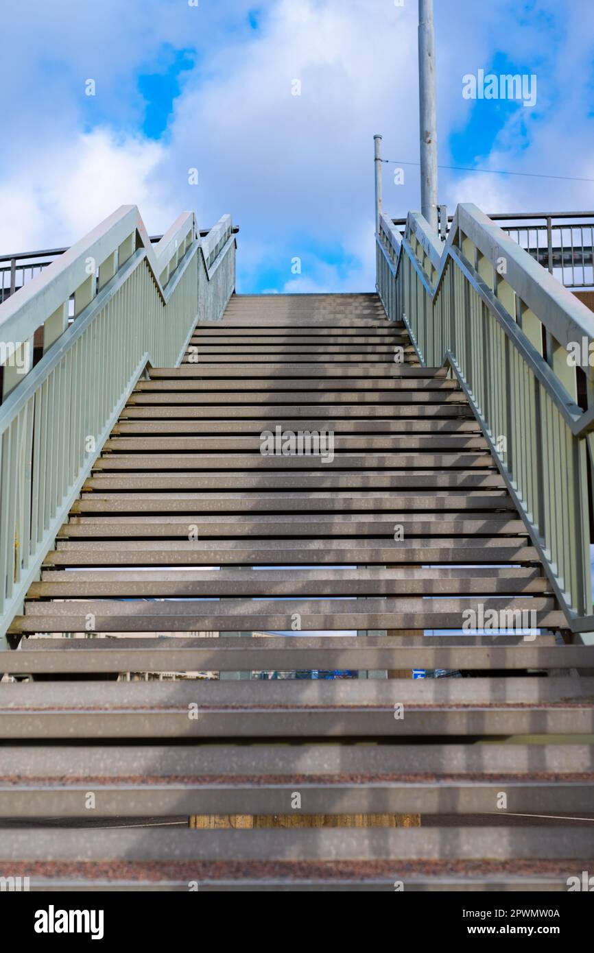 Tall stairs leading up to a roadway Stock Photo - Alamy