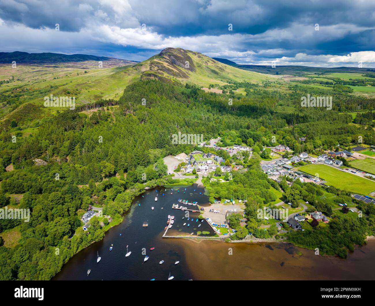 Aerial viewof a conical shaped hill overlooking a small village ...