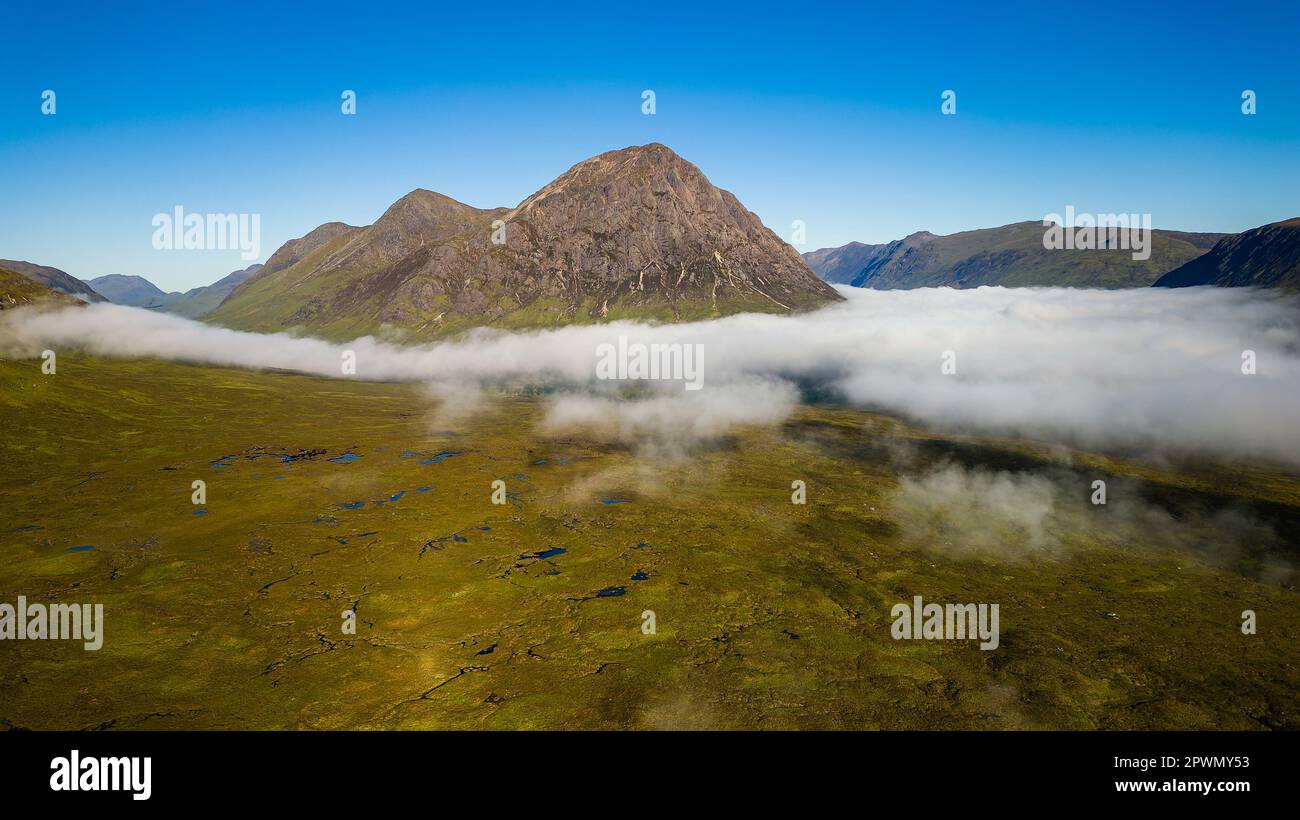 Aerial view of low cloud and fog in a valley just after dawn (Glencoe ...