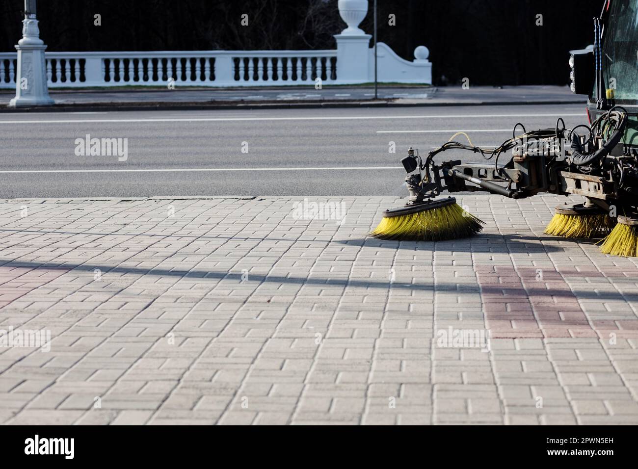 Brushs of street cleaning machine on street. Vehicle sweeping the ...