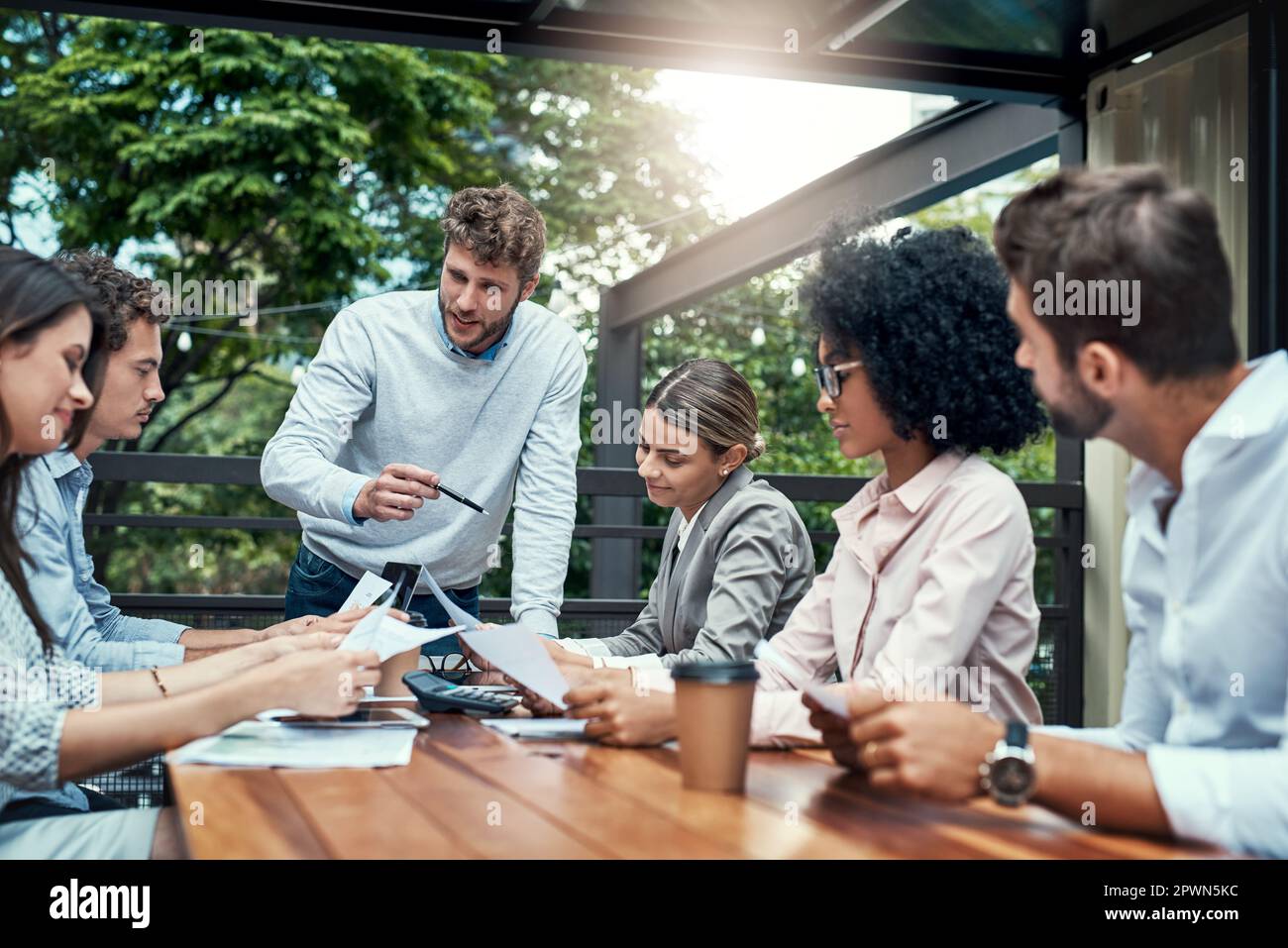 Getting their plans together. a group of colleagues having a meeting at ...