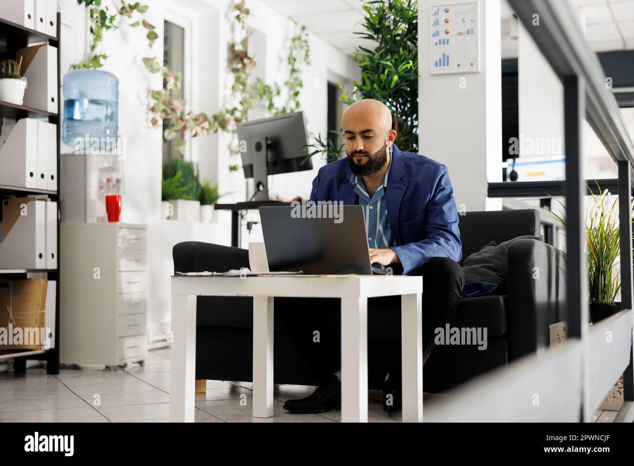 Arab businessman working on laptop in start up business office. Man ...