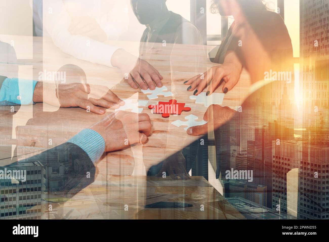 Business people connect pieces of puzzle like a teamwork Stock Photo ...