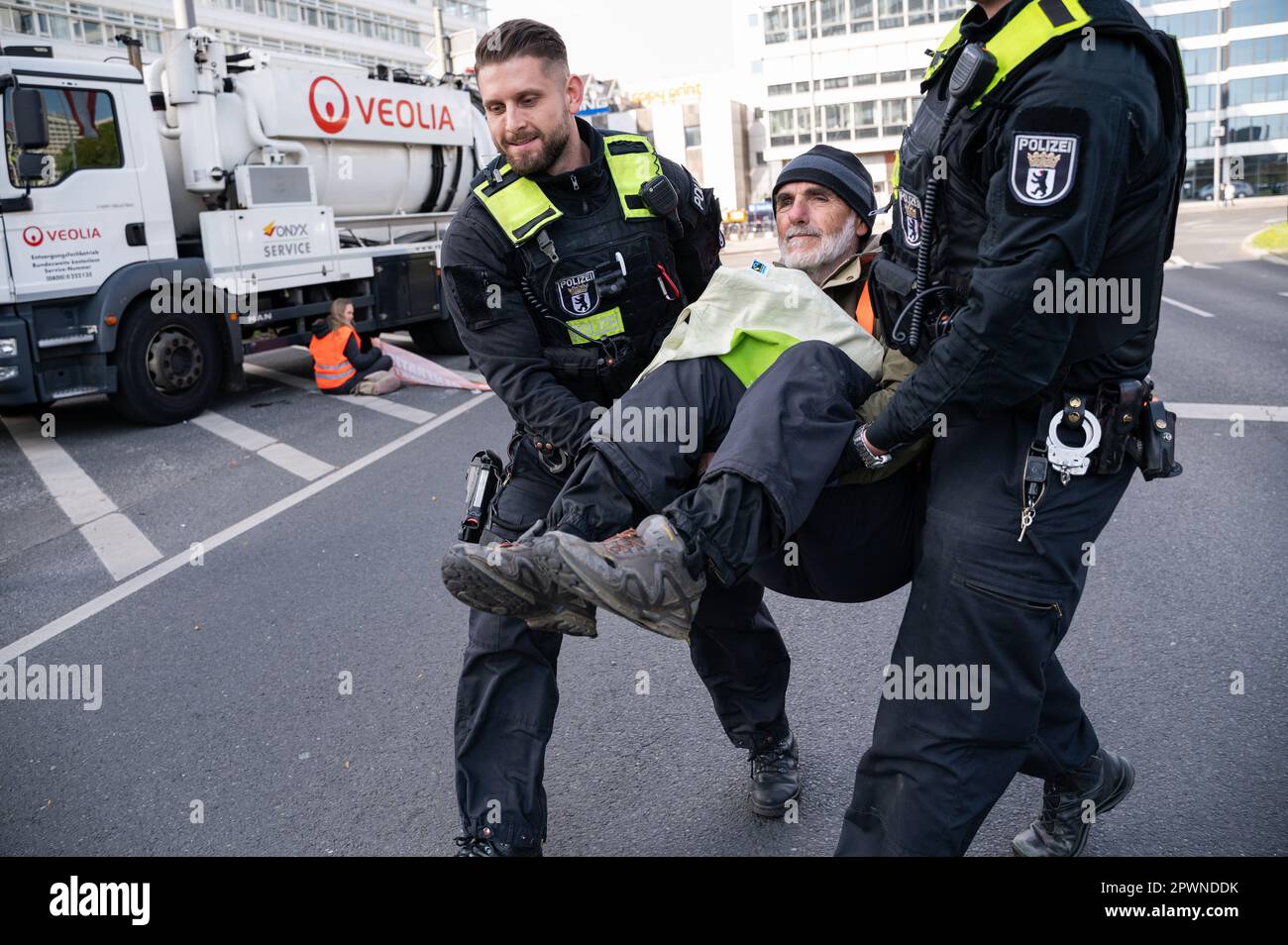 28.04.2023, Berlin, Germany, Europe - Policemen carry a Last Generation ...