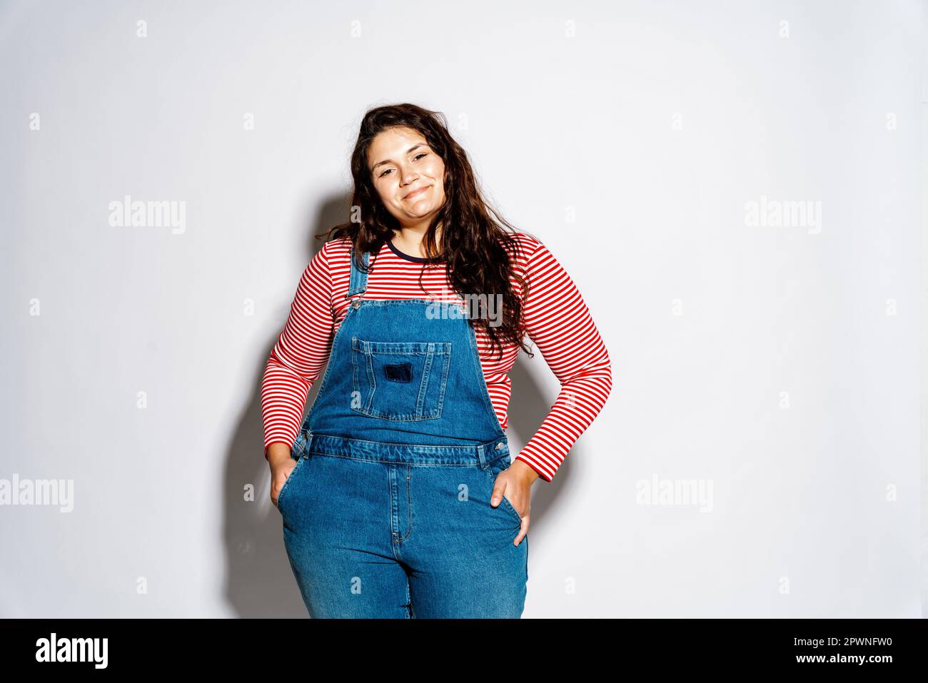 Plus size woman model posing in studio and having fun. Shots taken on ...