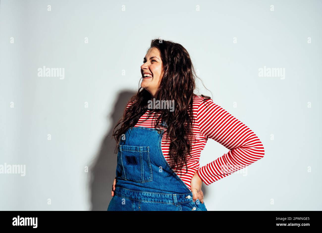 Plus size woman model posing in studio and having fun. Shots taken on ...