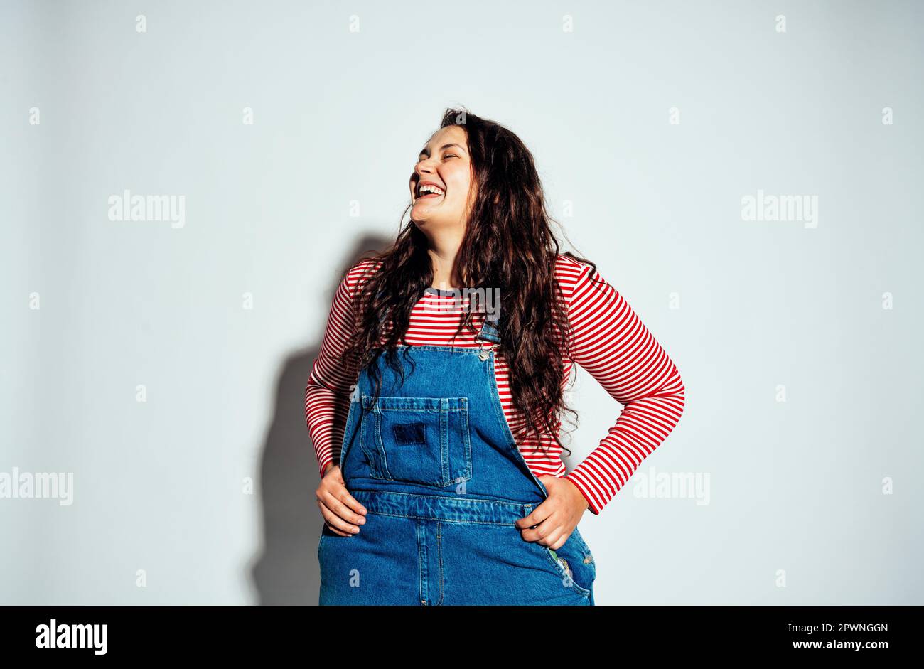 Plus size woman model posing in studio and having fun. Shots taken on ...