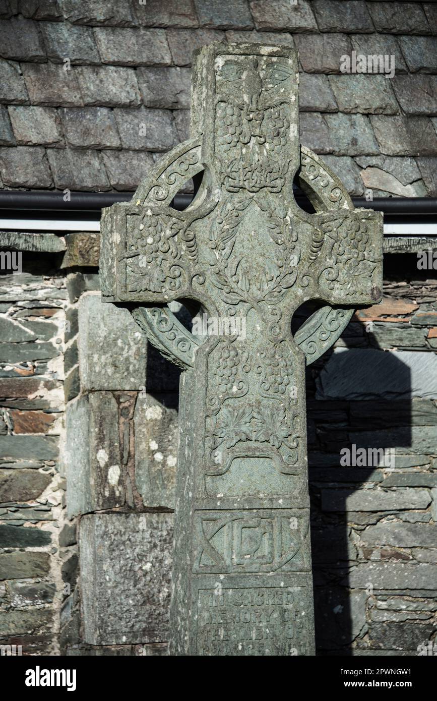 Lakeland slate cross in the grounds of Holy Trinity church, Grange in ...