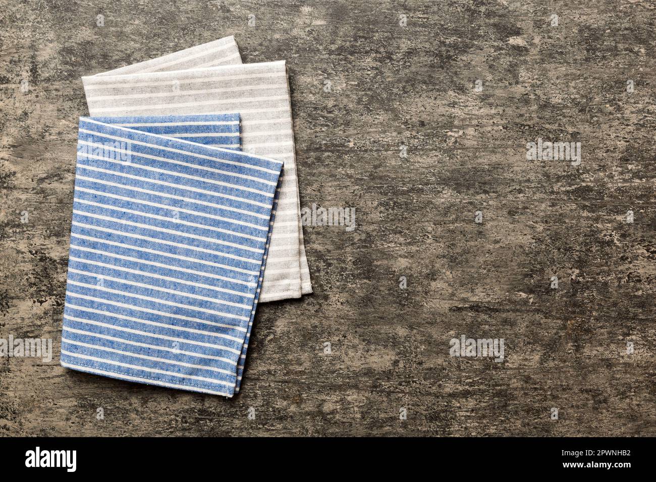 top view with blue kitchen napkin isolated on table background. Folded ...