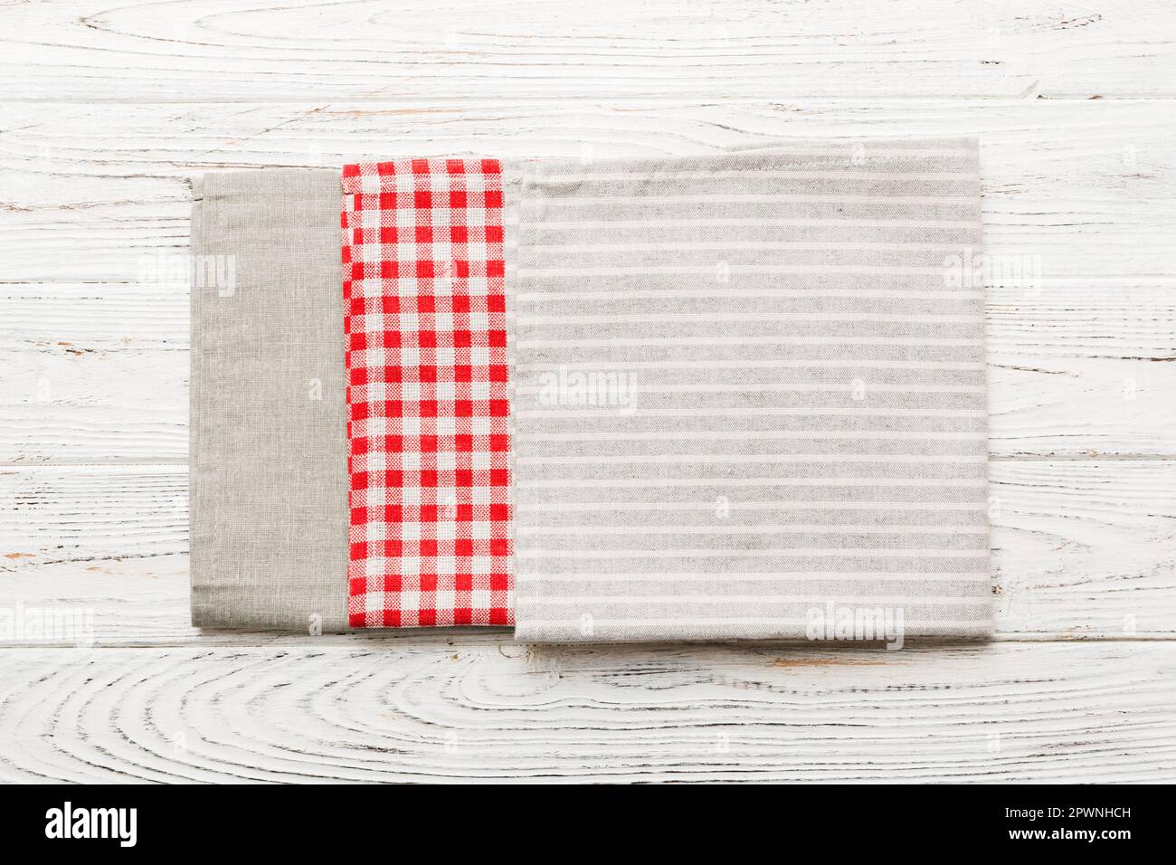 top view with gray kitchen napkin isolated on table background. Folded ...