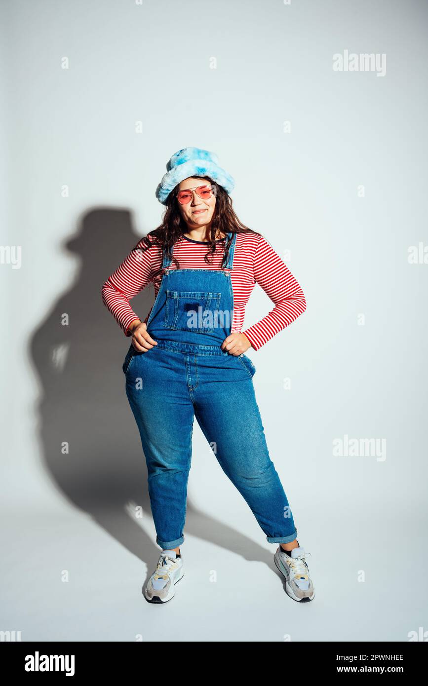 Plus size woman model posing in studio and having fun. Shots taken on ...