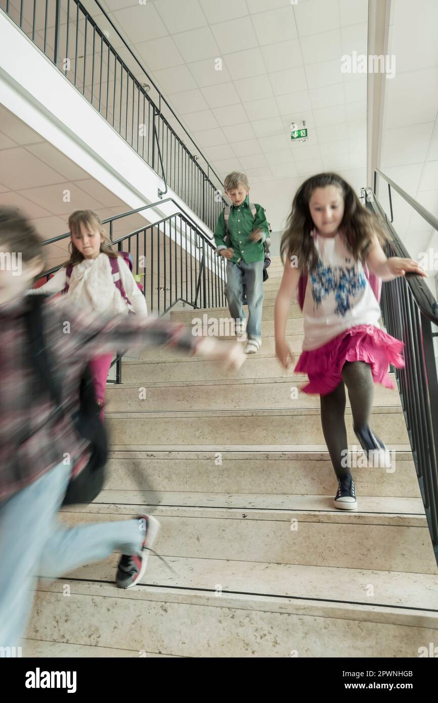 School students running down stairs, Bavaria, Germany Stock Photo - Alamy