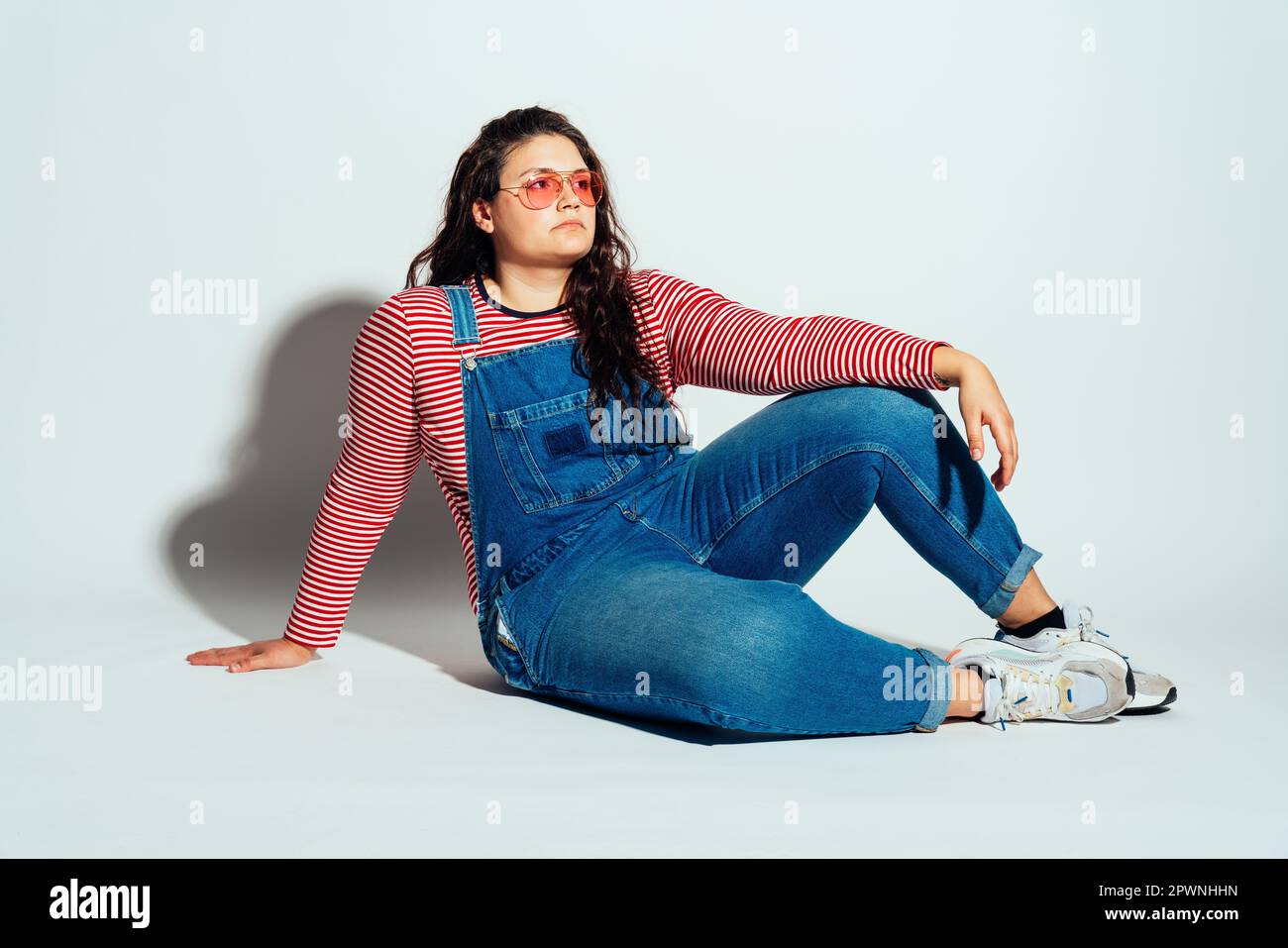 Plus size woman model posing in studio and having fun. Shots taken on ...