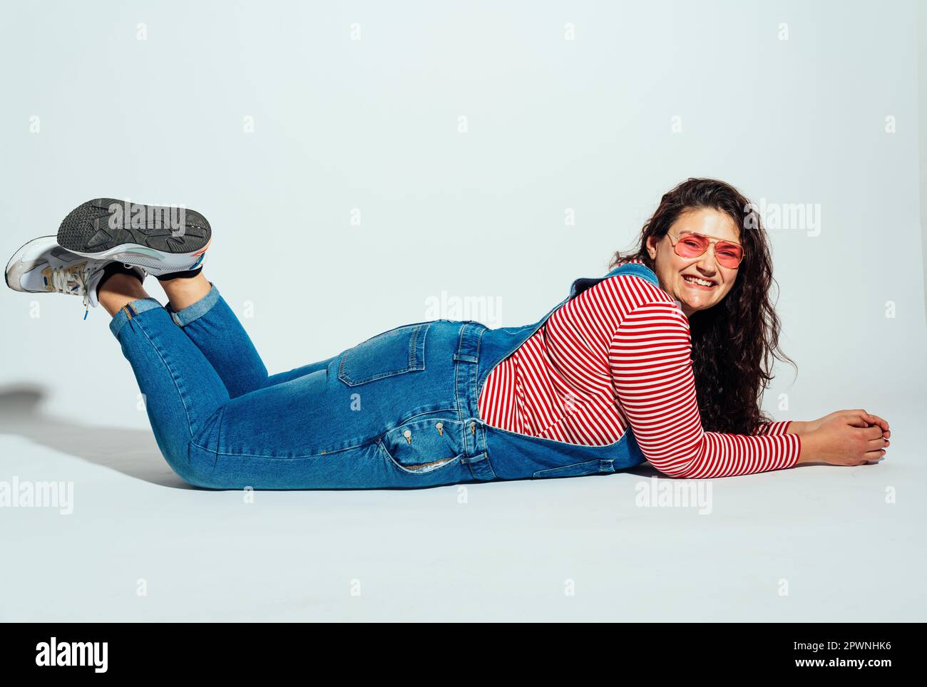 Plus size woman model posing in studio and having fun. Shots taken on ...