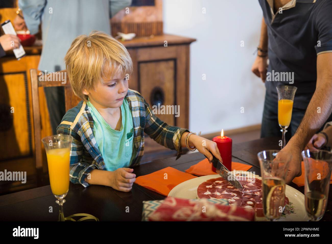 Little boy cutting birthday cake Stock Photo - Alamy