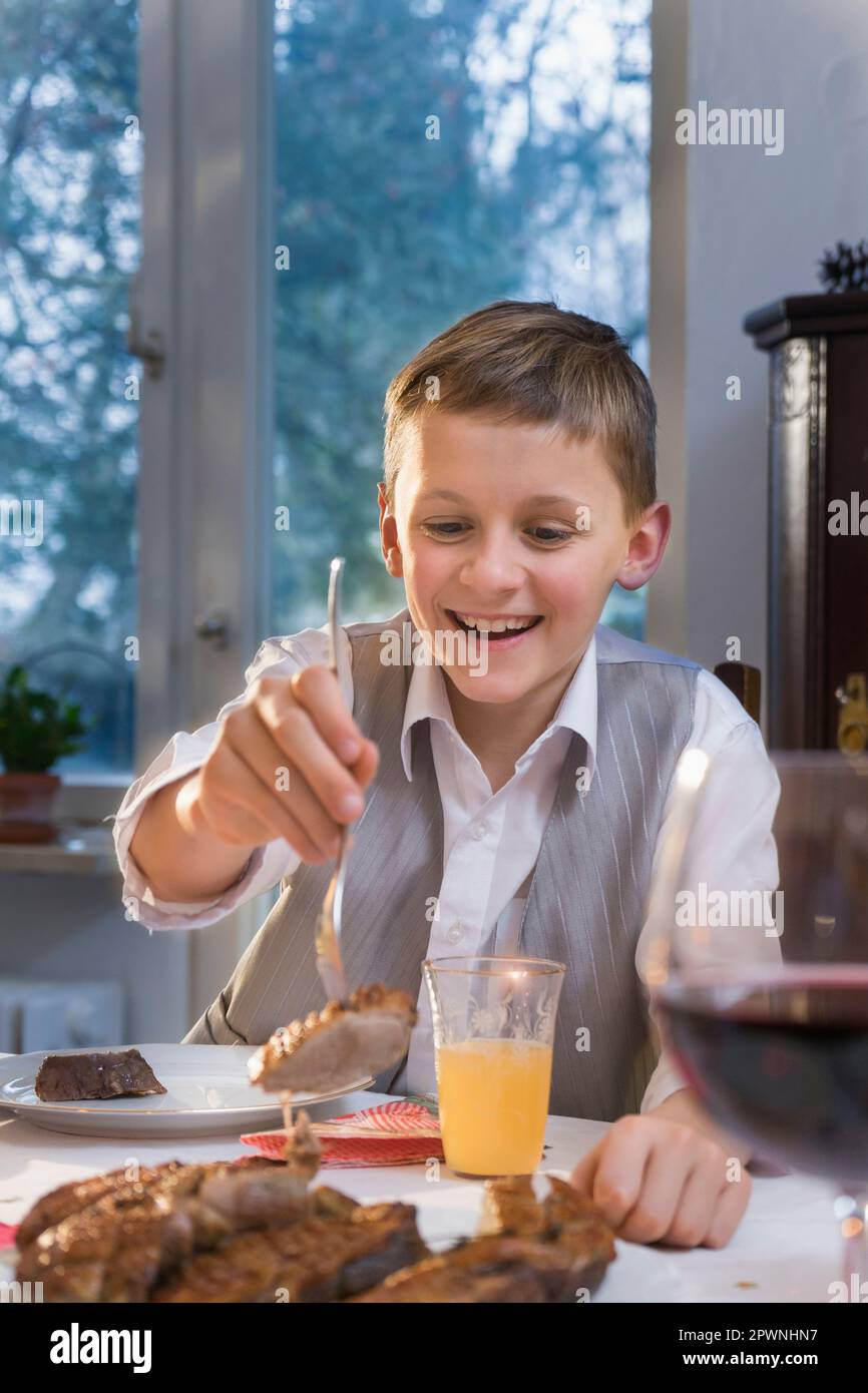 Germany eating boy dinner hi-res stock photography and images - Alamy