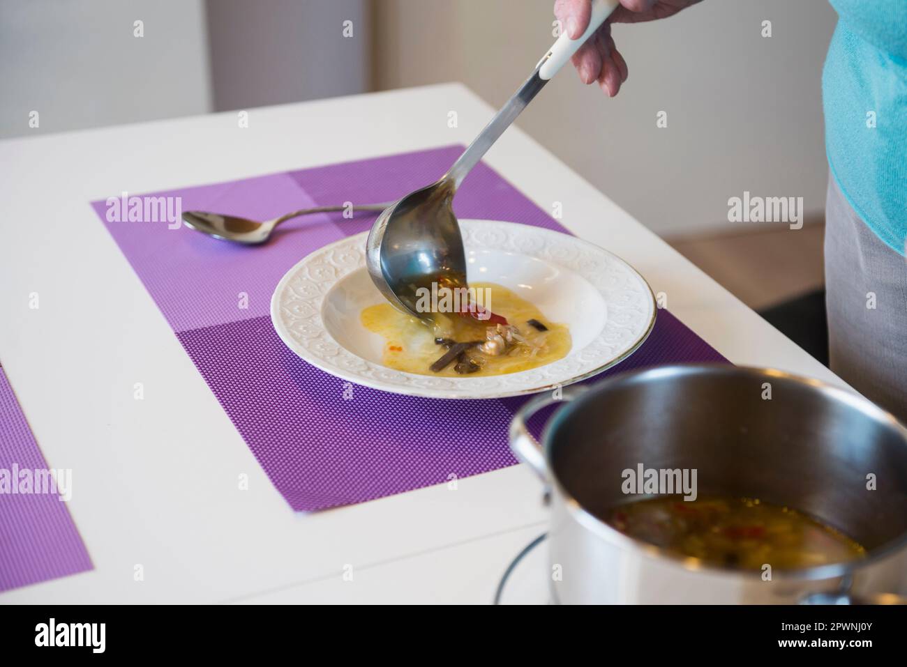 Woman senior eating soup hi-res stock photography and images - Alamy