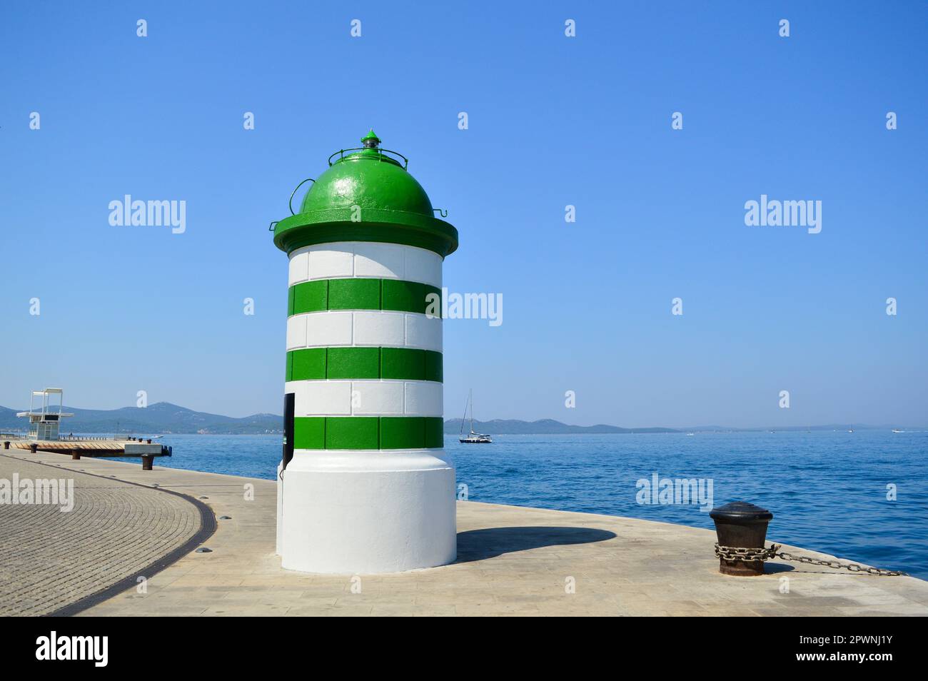 Small signal green lighthouse in Zadar, Croatia Stock Photo - Alamy