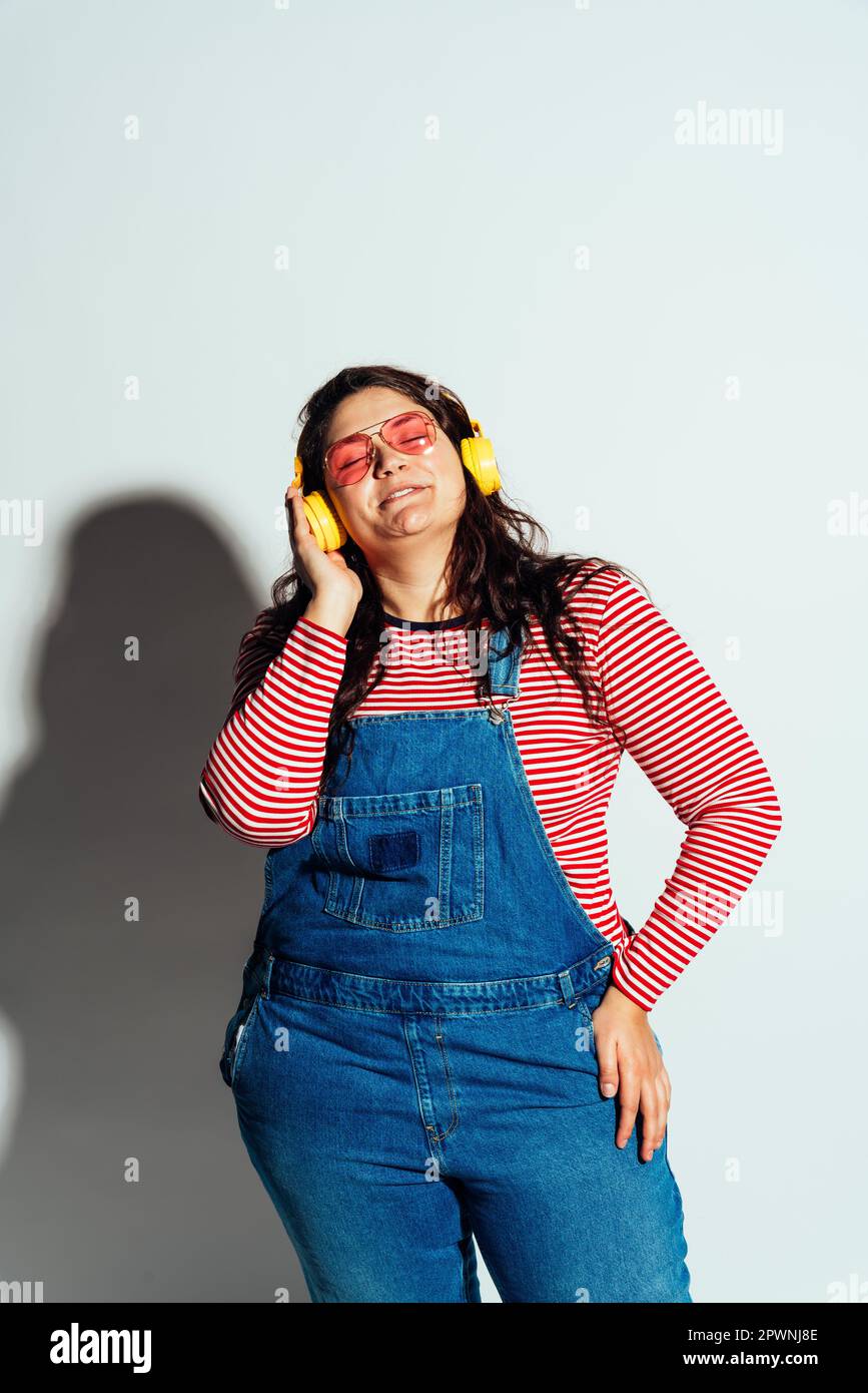 Plus size woman model posing in studio and having fun. Shots taken on ...