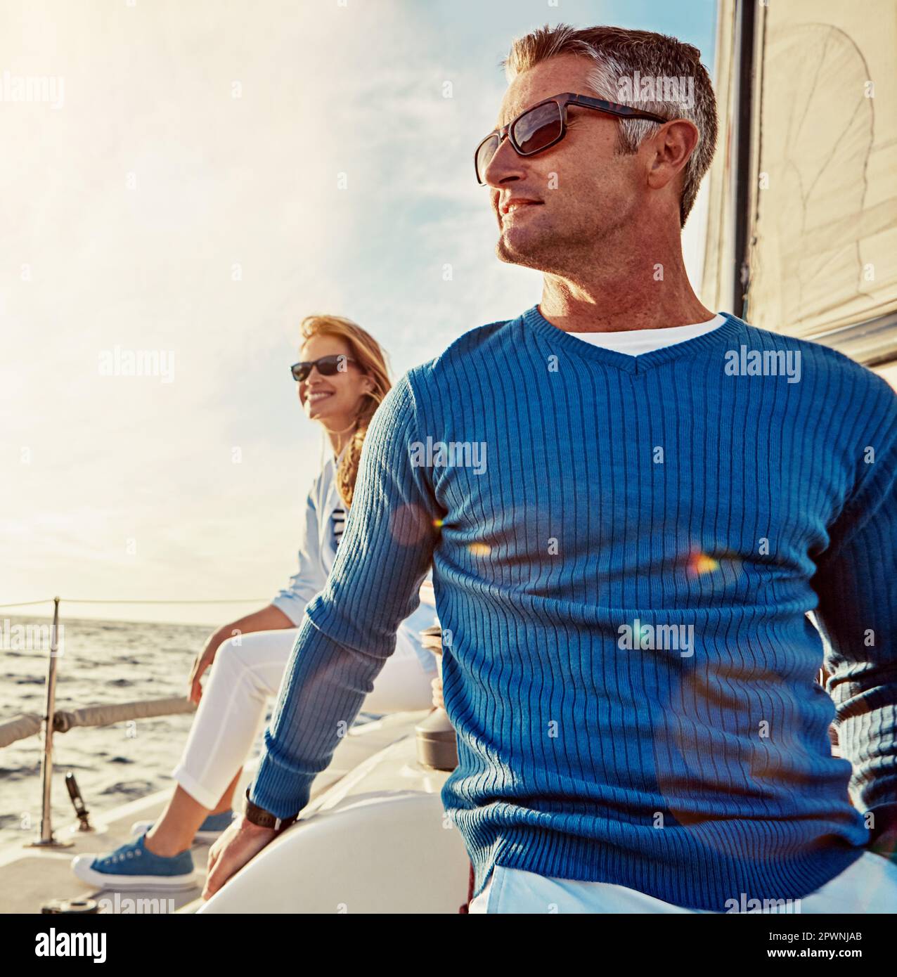 Go out and see the beauty of the ocean. a couple out sailing on a yacht ...