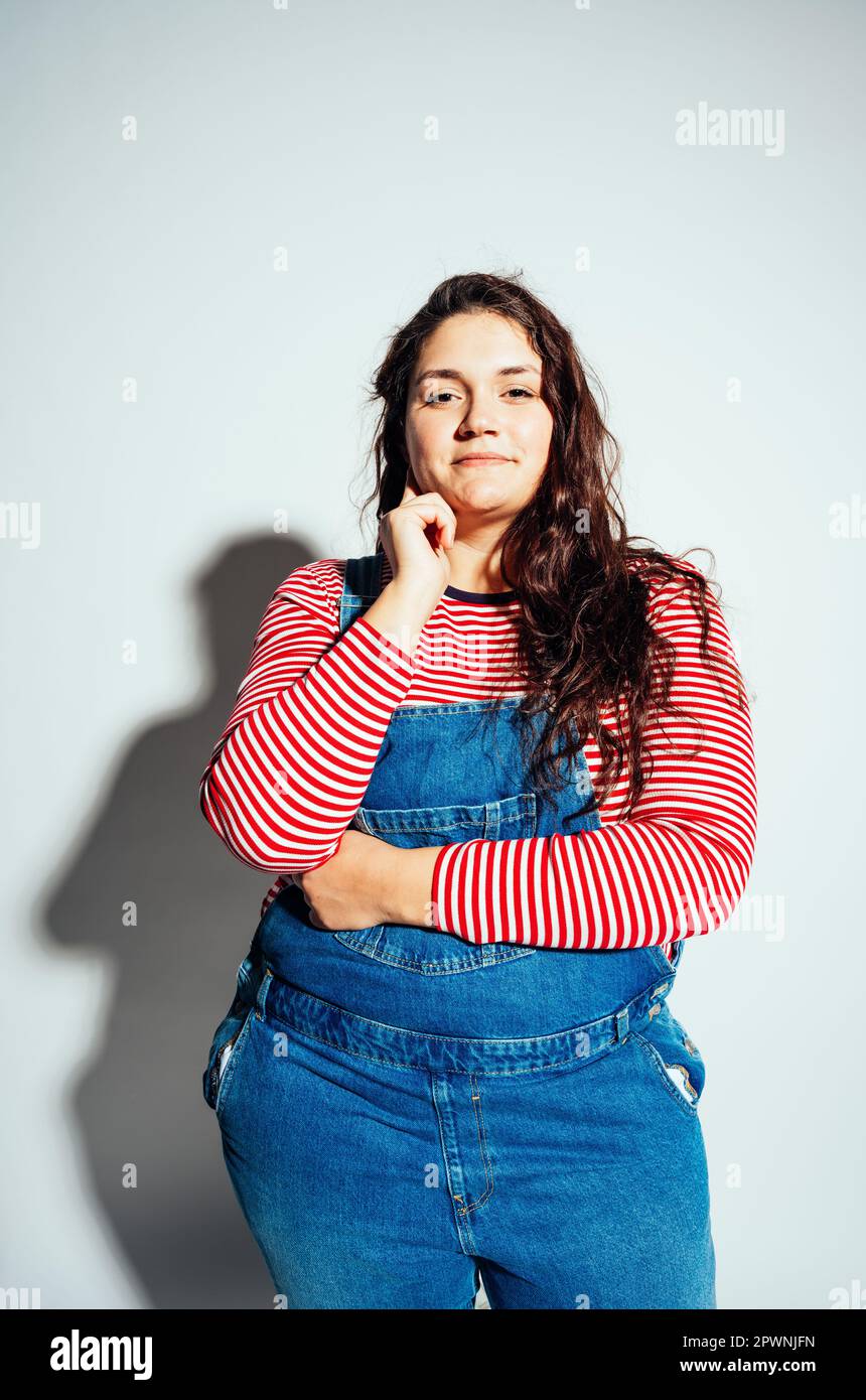 Plus size woman model posing in studio and having fun. Shots taken on ...