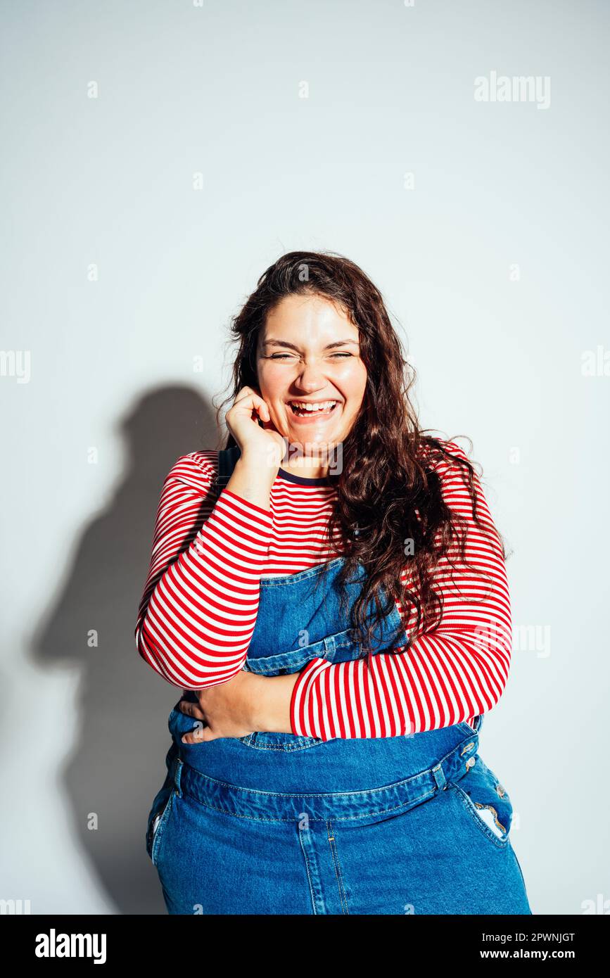 Plus size woman model posing in studio and having fun. Shots taken on ...