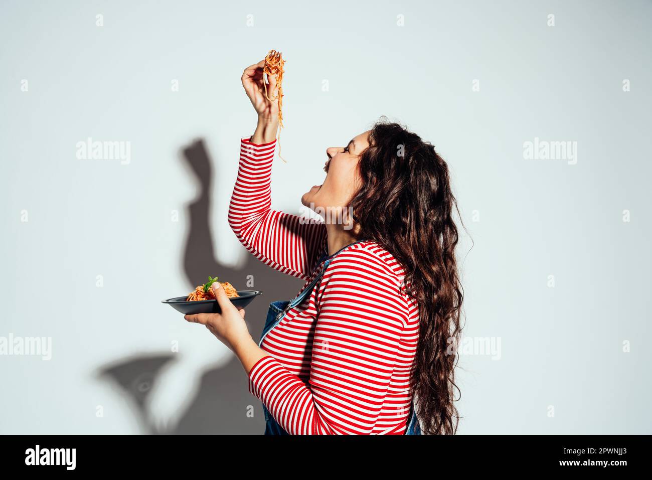 Plus size woman model posing in studio and having fun. Happy model ...