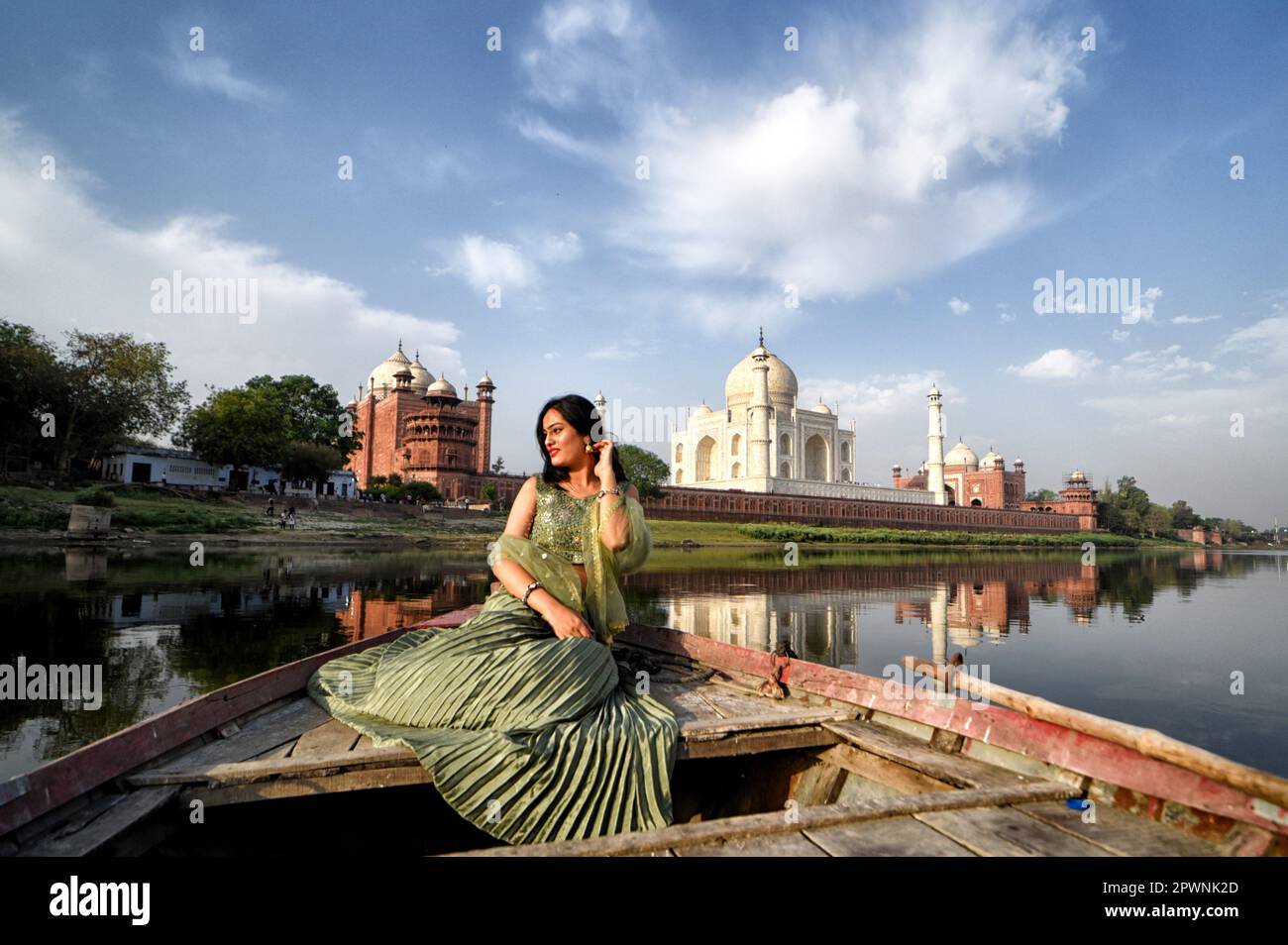 Nandini Singh, a female model poses for photos on a boat over Yamuna ...