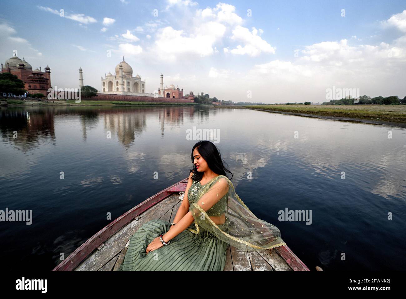 Nandini Singh, a female model poses for photos on a boat over Yamuna ...