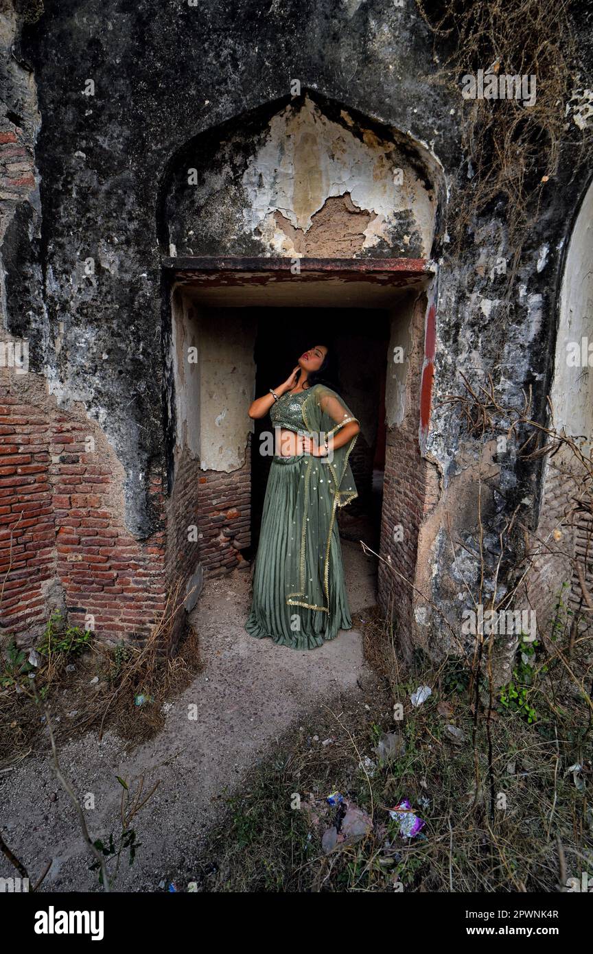 Nandini Singh, a female model poses for photos at the old fort near of ...