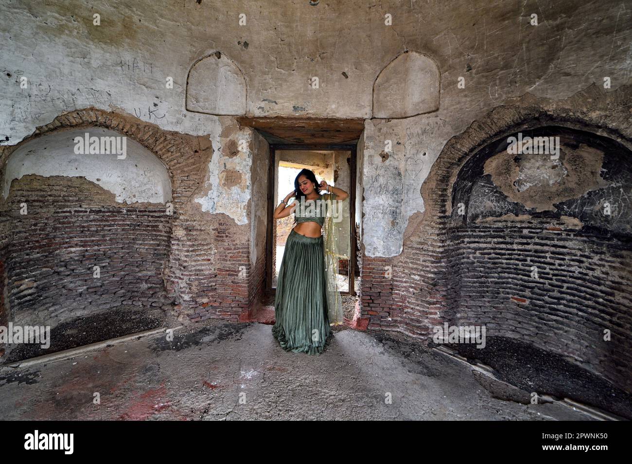 Nandini Singh, a female model poses for photos at the old fort near of ...