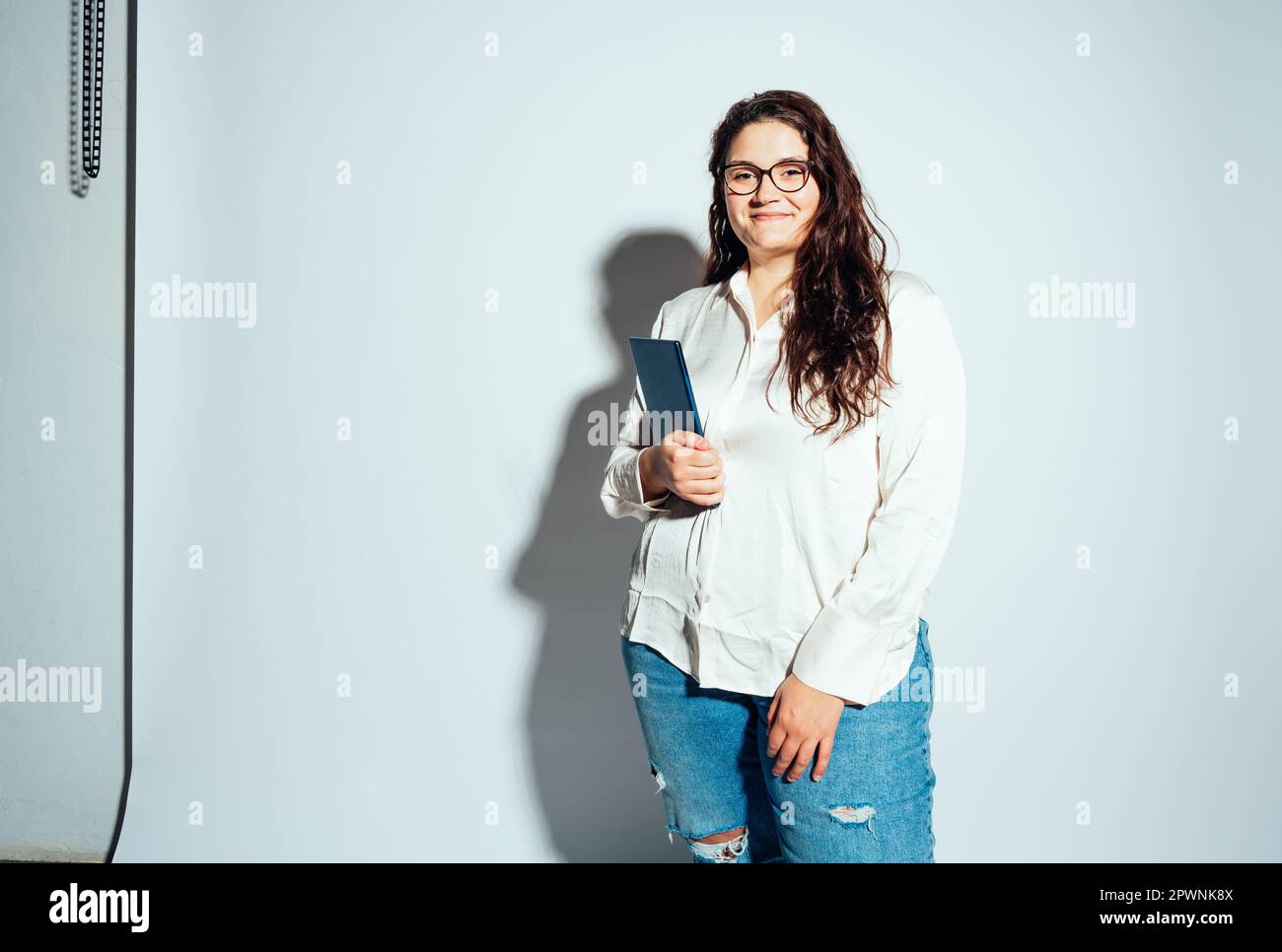 Plus size woman model posing in studio and having fun on white ...