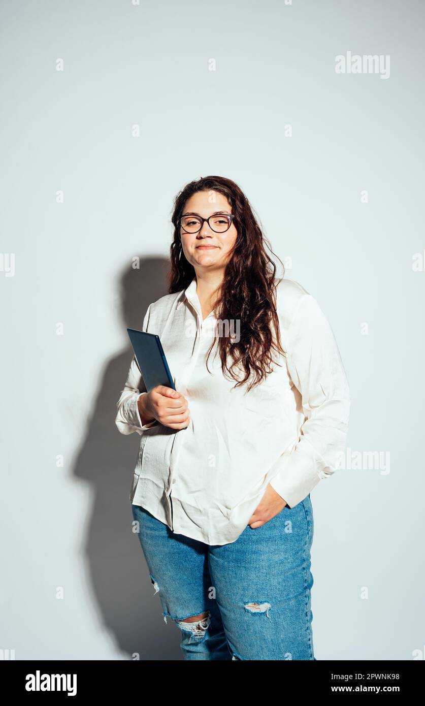 Plus size woman model posing in studio and having fun on white ...