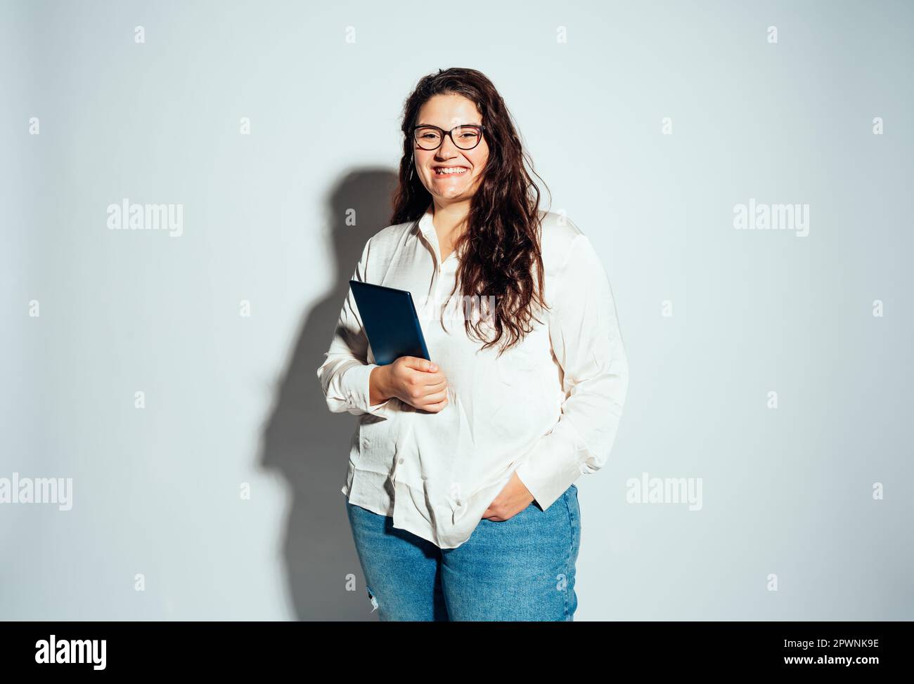 Plus size woman model posing in studio and having fun on white ...