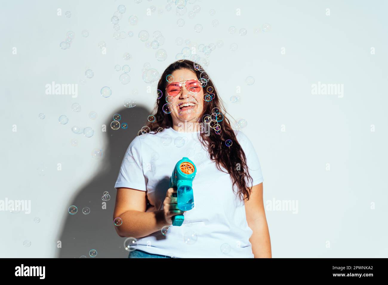 Plus size woman model posing in studio and having fun Stock Photo - Alamy