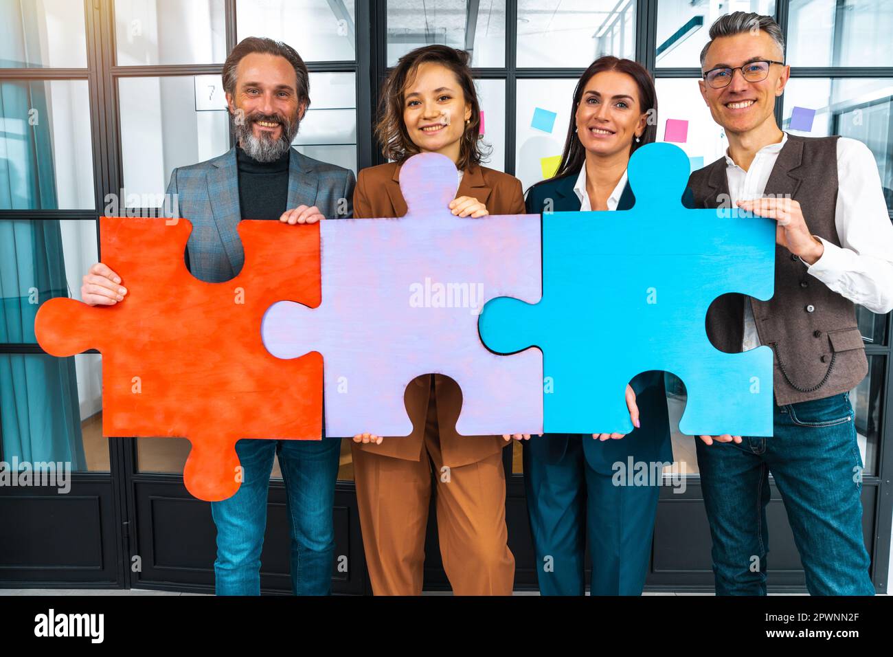 Business people connect puzzle pieces as integration and startup Stock ...