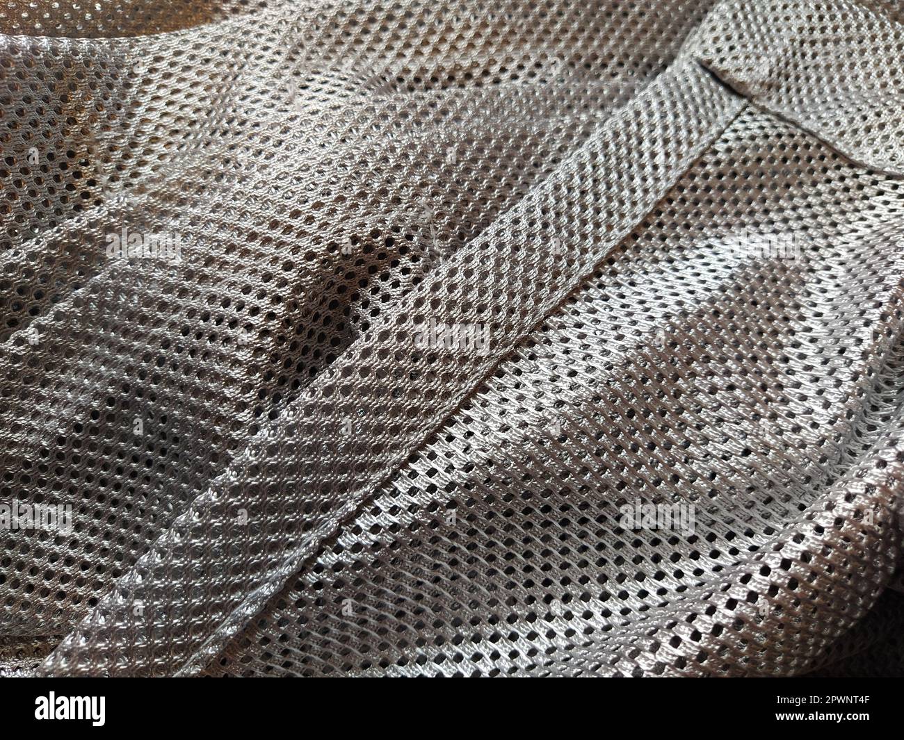 detail of texture of a grey fabric with holes Stock Photo - Alamy