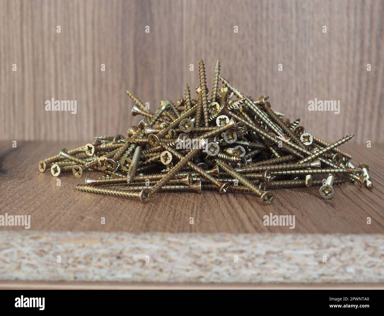 wood screws on melamine manufactured wood panel Stock Photo - Alamy