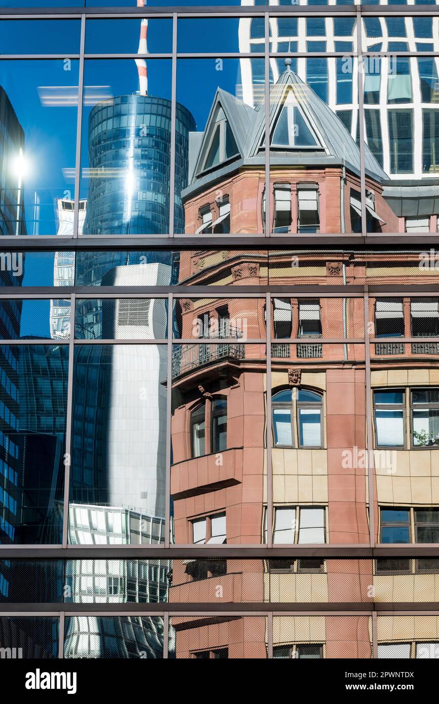 Old and modern buildings reflected in the glass facade of a house Stock ...